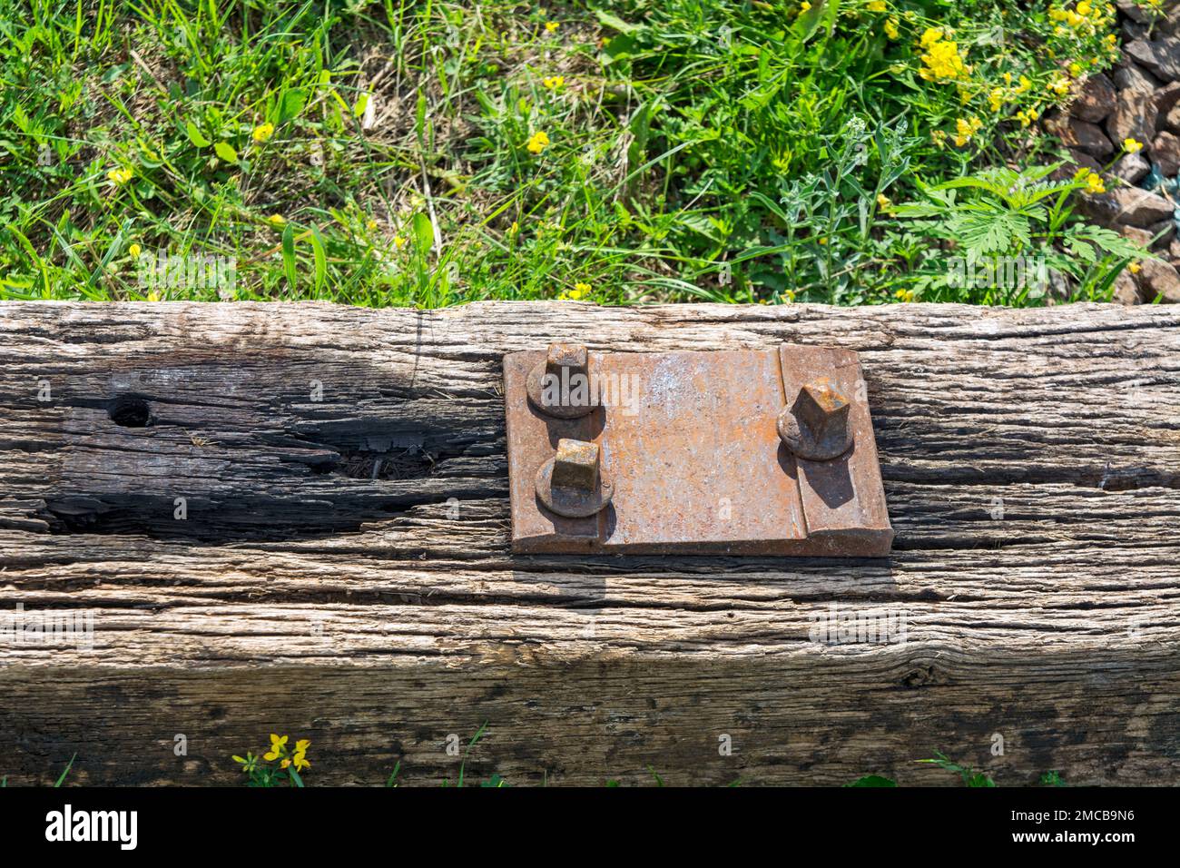 One old railway sleeper with a metal plate carrying the rail Stock ...