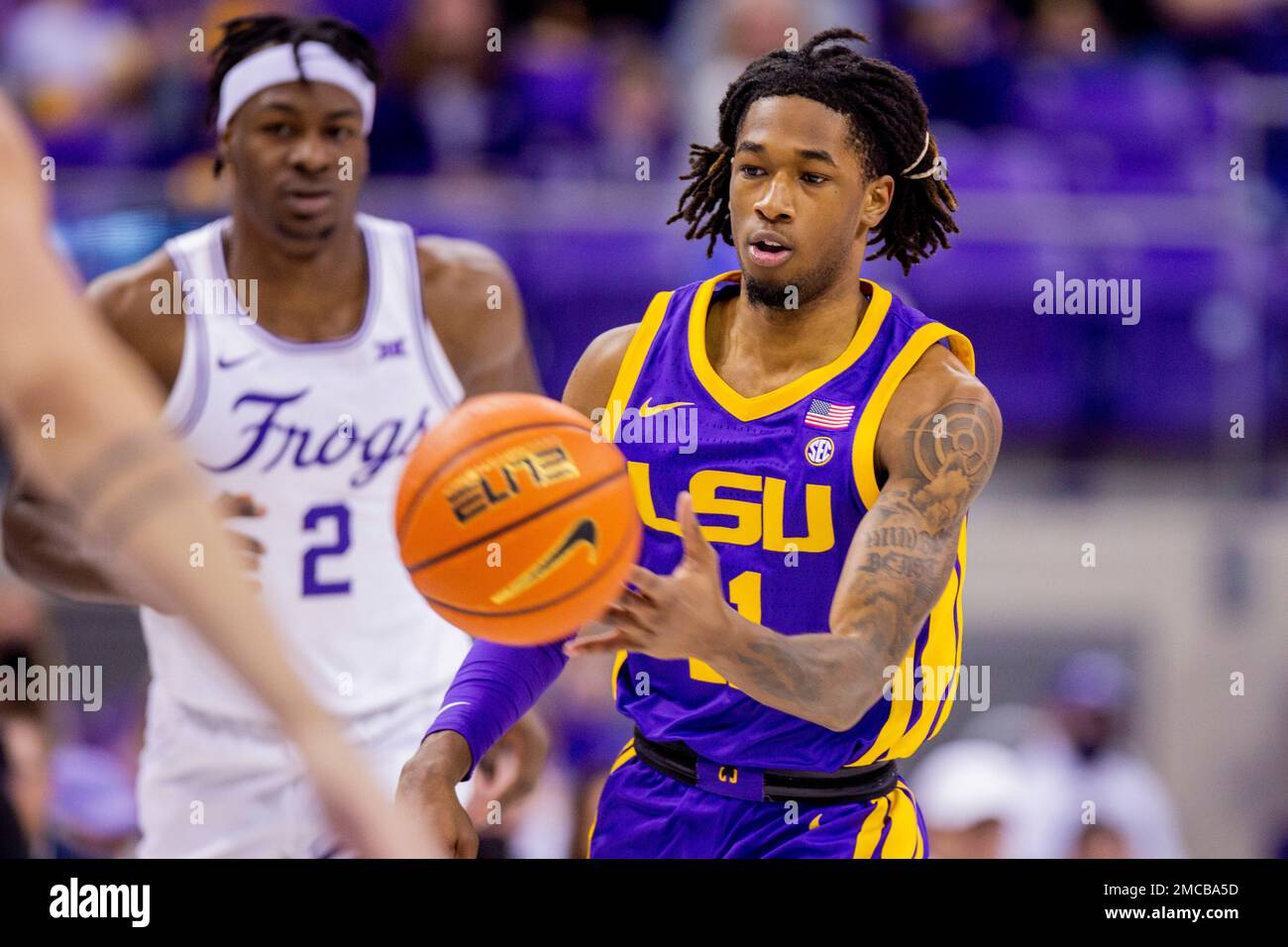 LSU guard Justice Williams, right, passes the ball while bringing the ...