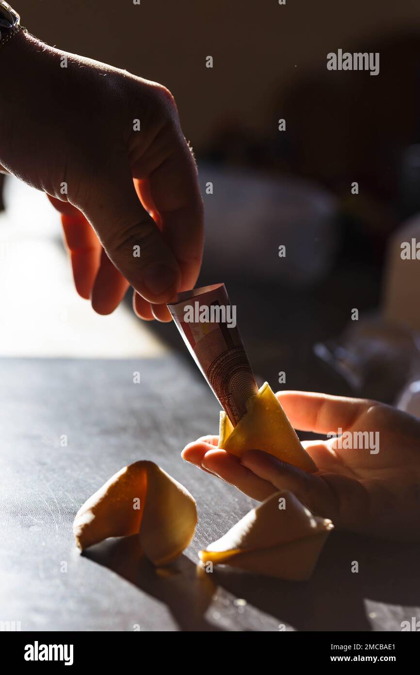 Inserting euro into cookie hi-res stock photography and images - Alamy