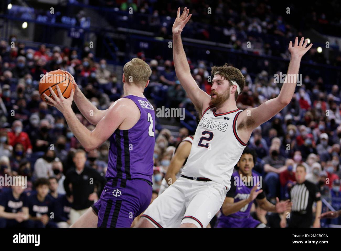 Gonzaga forward Drew Timme, right, defends Portland guard Tyler ...
