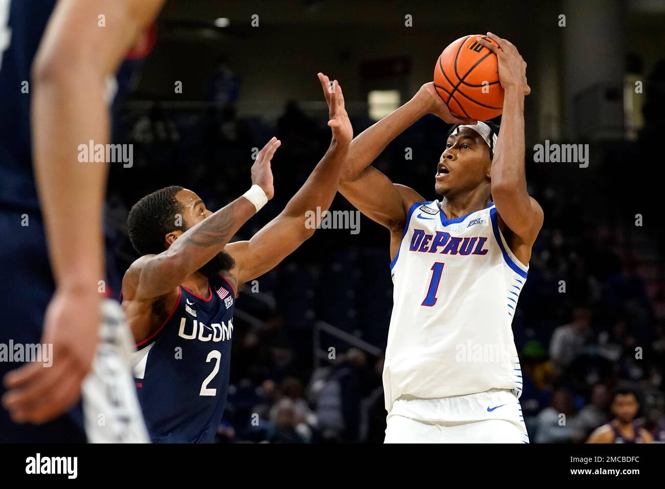 DePaul's Javan Johnson (1) shoots over Connecticut's R.J. Cole during ...