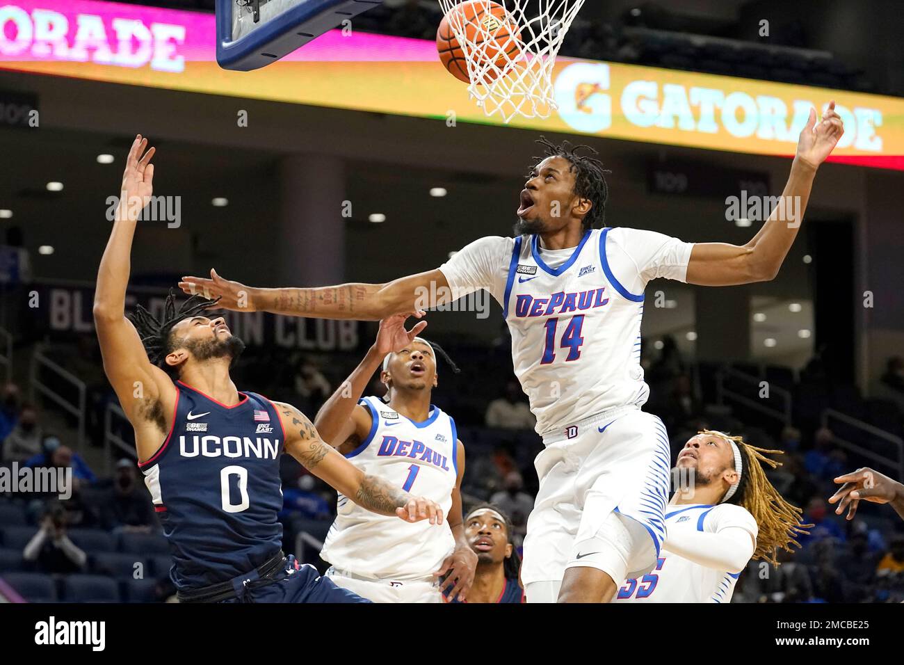 DePaul's Nick Ongenda (14) blocks the shot of Connecticut's Jalen ...