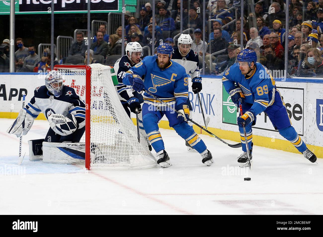 Winnipeg Jets goaltender Eric Comrie (1) defends the goal as St. Louis ...