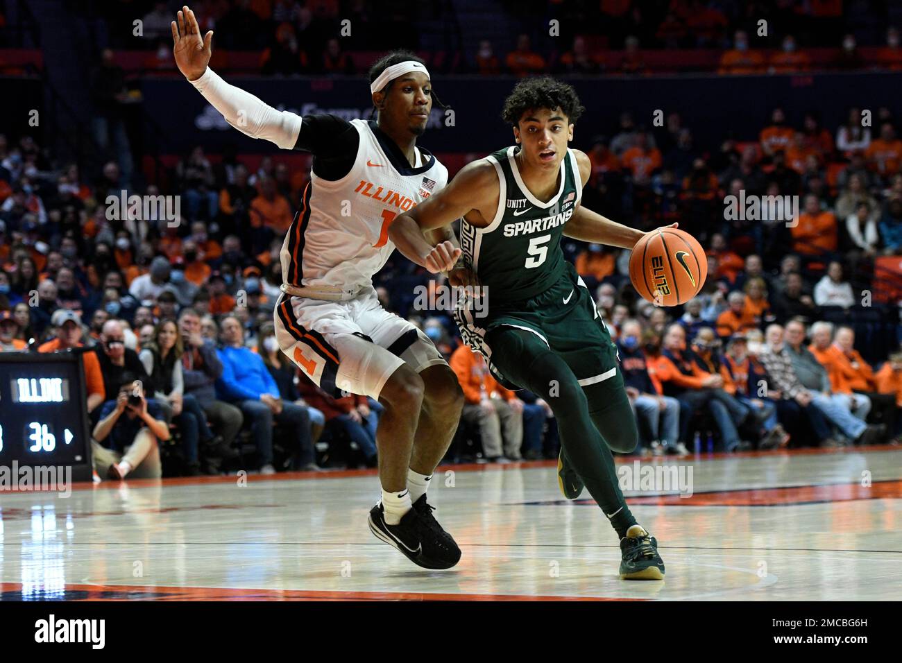 Michigan State's Max Christie (5) dribbles as Illinois' Trent Frazier ...