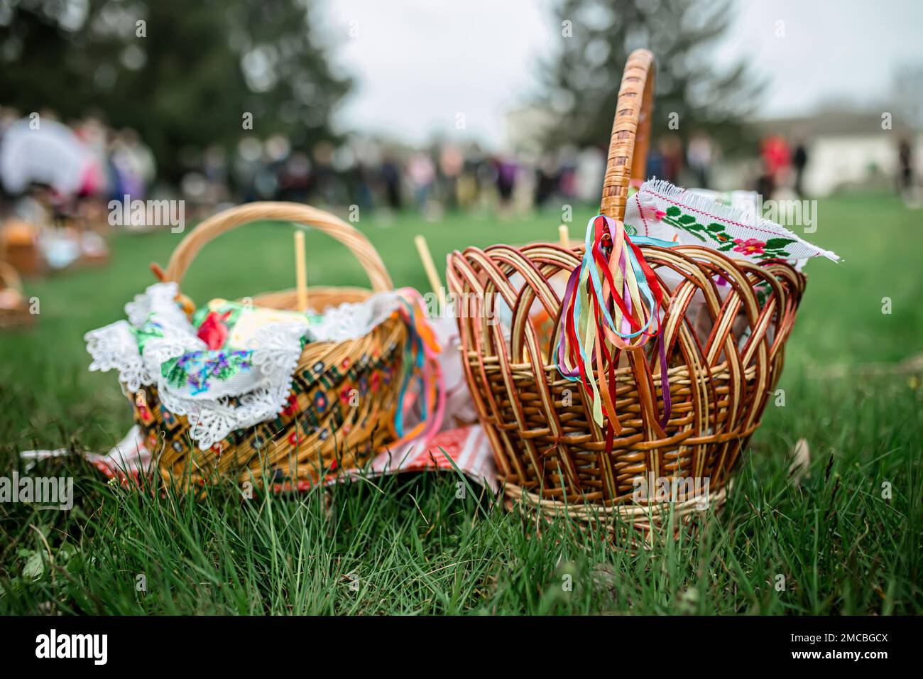 Easter baskets on the grass during the liturgy for Orthodox Easter ...