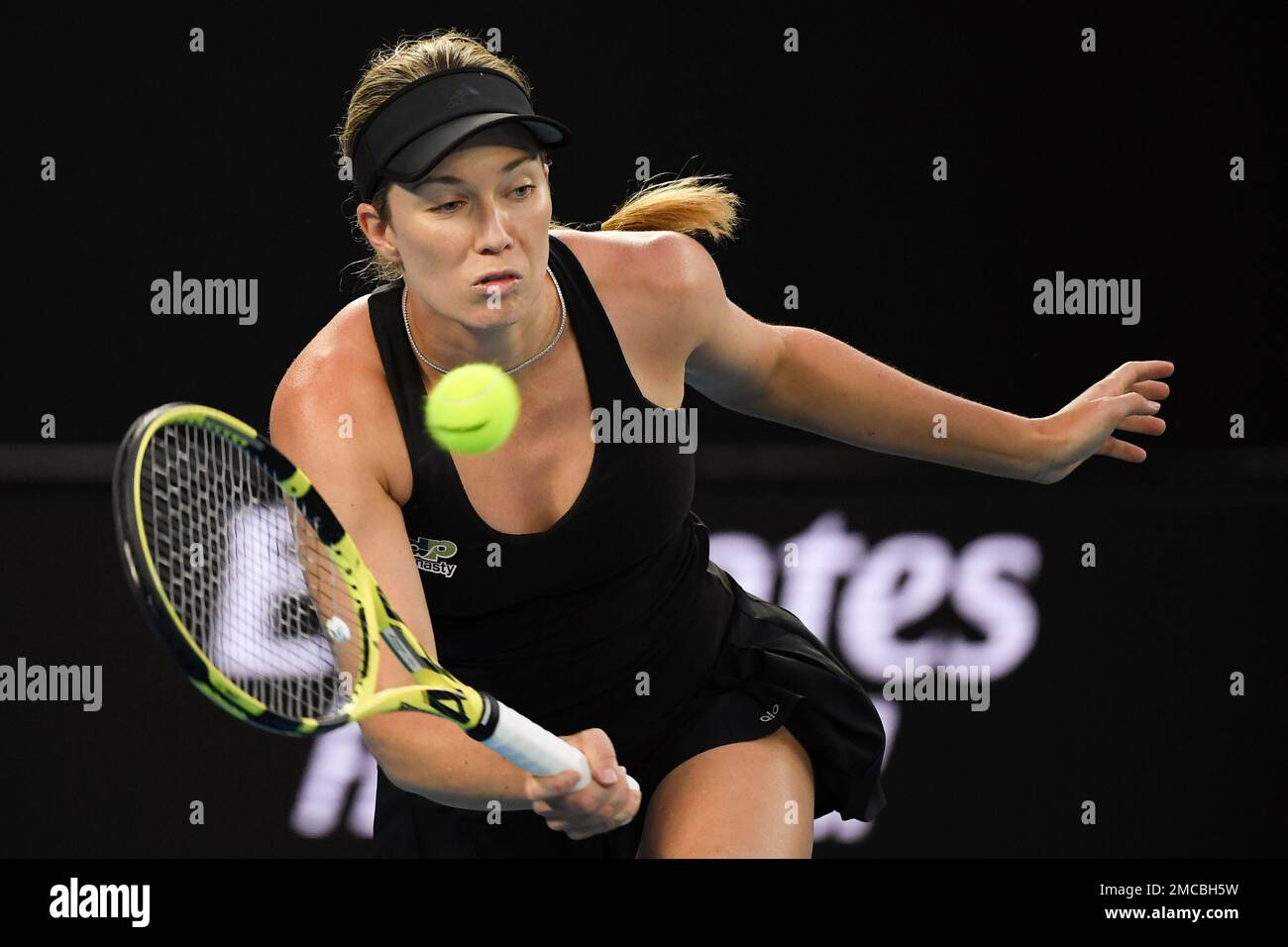 Danielle Collins of the U.S. plays a forehand return to Ash Barty of Australia during the women ...