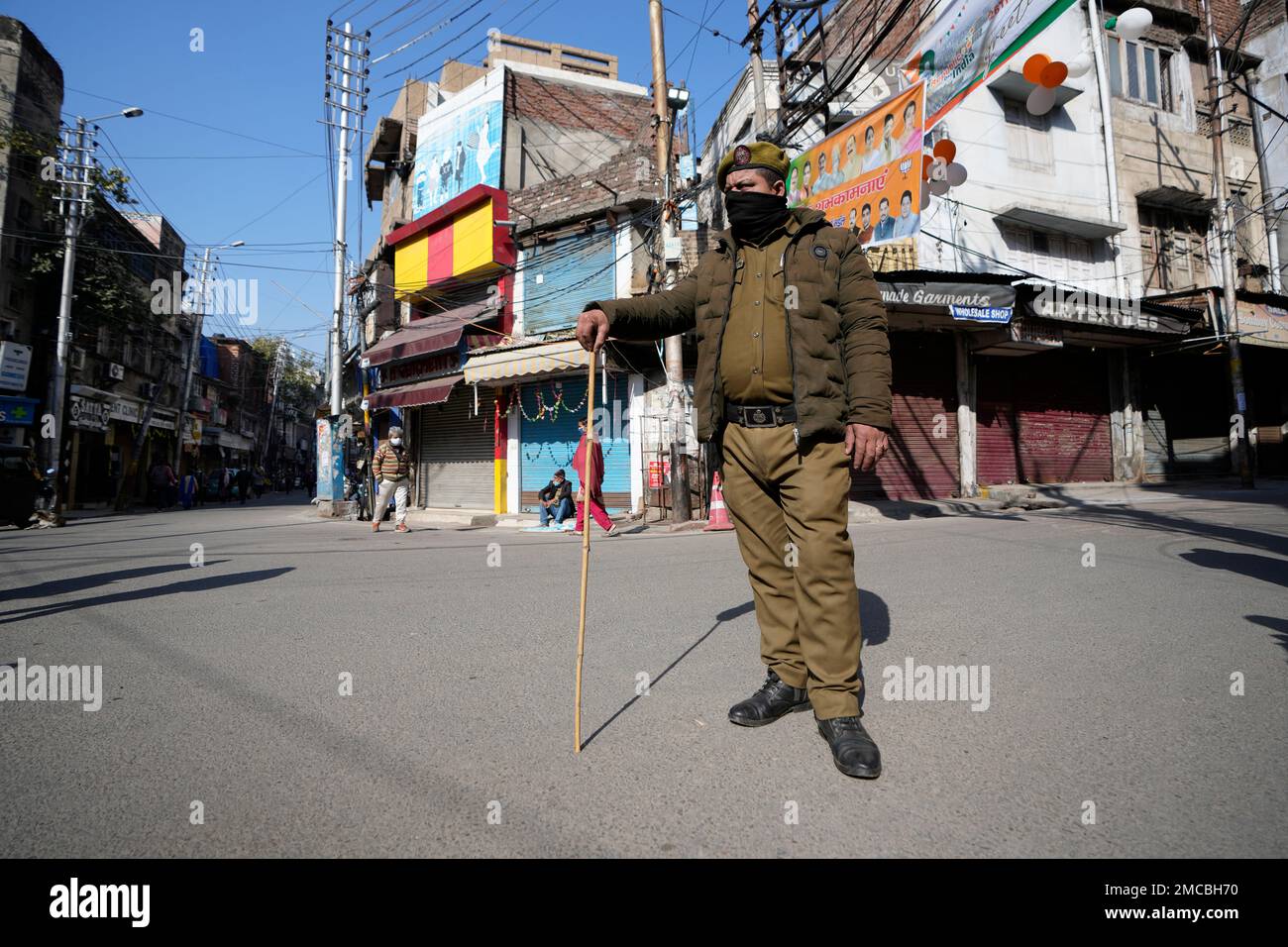 A policeman stands guard during a weekend lockdown imposed to curb the ...