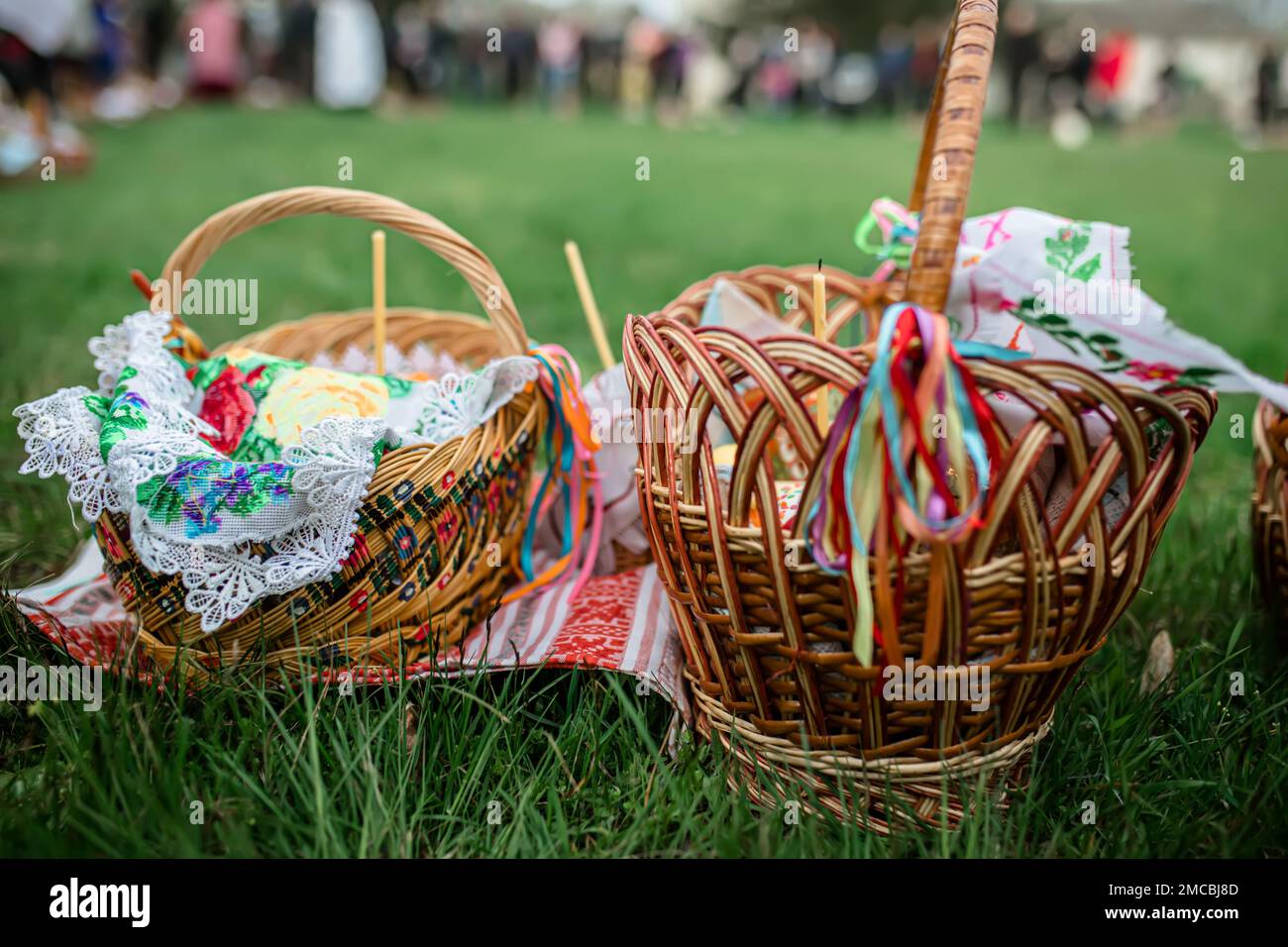 Easter baskets on the grass during the liturgy for Orthodox Easter ...