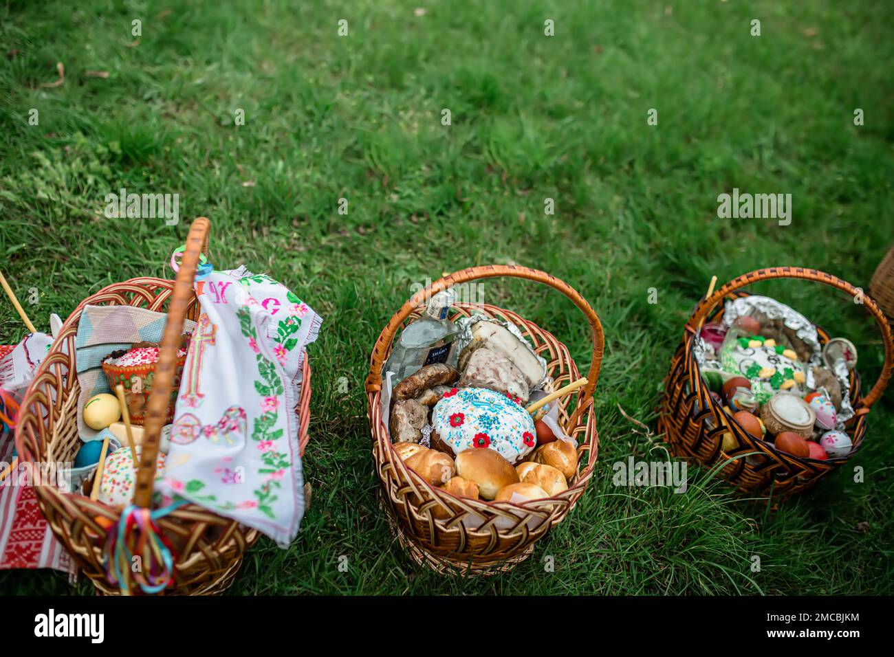 Easter baskets on the grass during the liturgy for Orthodox Easter ...