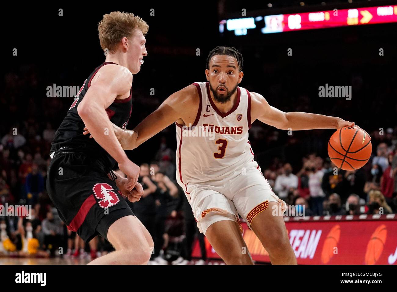Southern California forward Isaiah Mobley, right, drives by Stanford ...