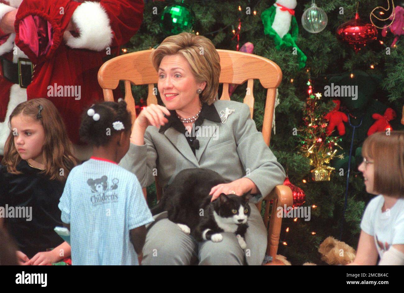 FILE - First lady Hillary Rodham Clinton pets Socks the cat on her lap ...