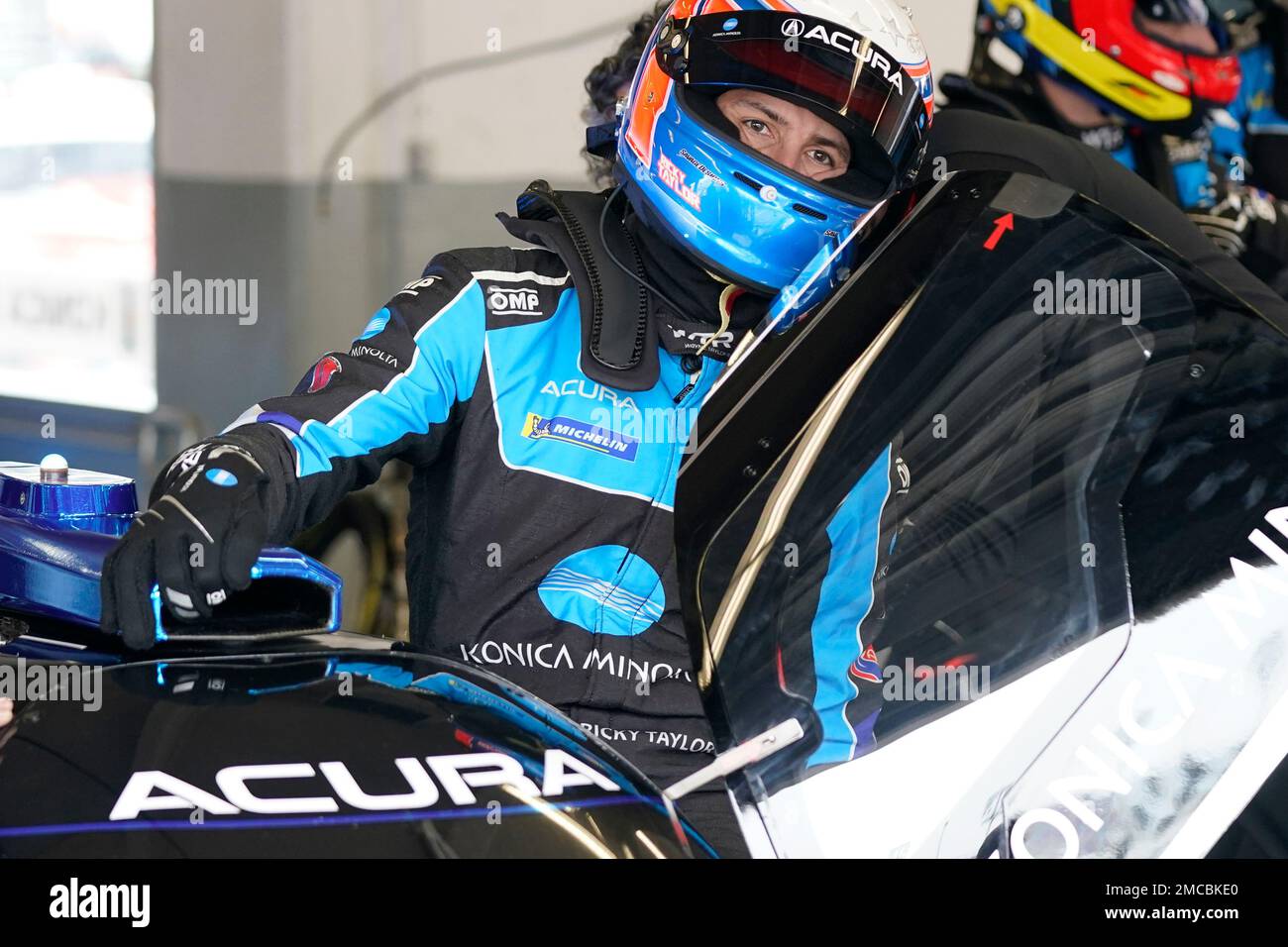 Ricky Taylor climbs in his car while practicing a driver change for the ...