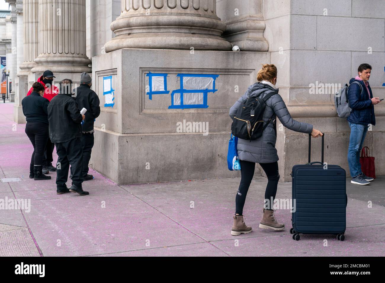 Blue tape and plastic covers swastikas drawn by vandals on the front of ...