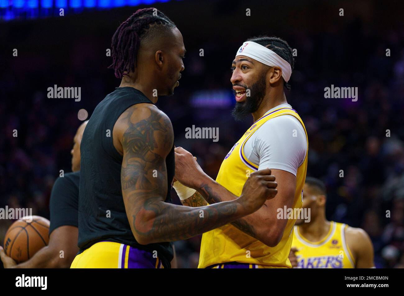 Los Angeles Lakers' Anthony Davis, right, talks with Dwight Howard ...