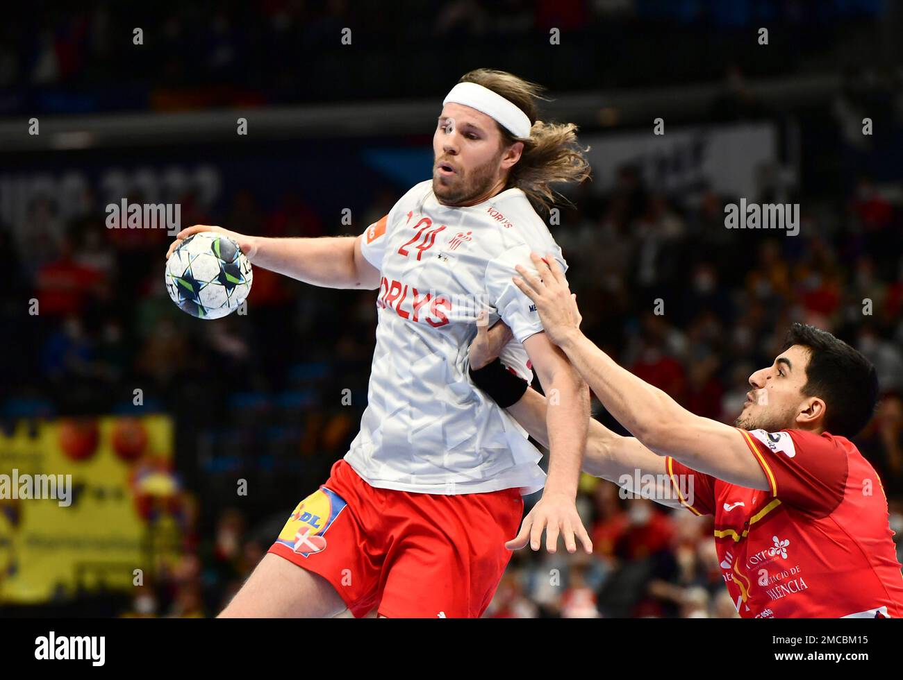Denmark's Mikkel Hansen, left, tries to score during the Men's European ...