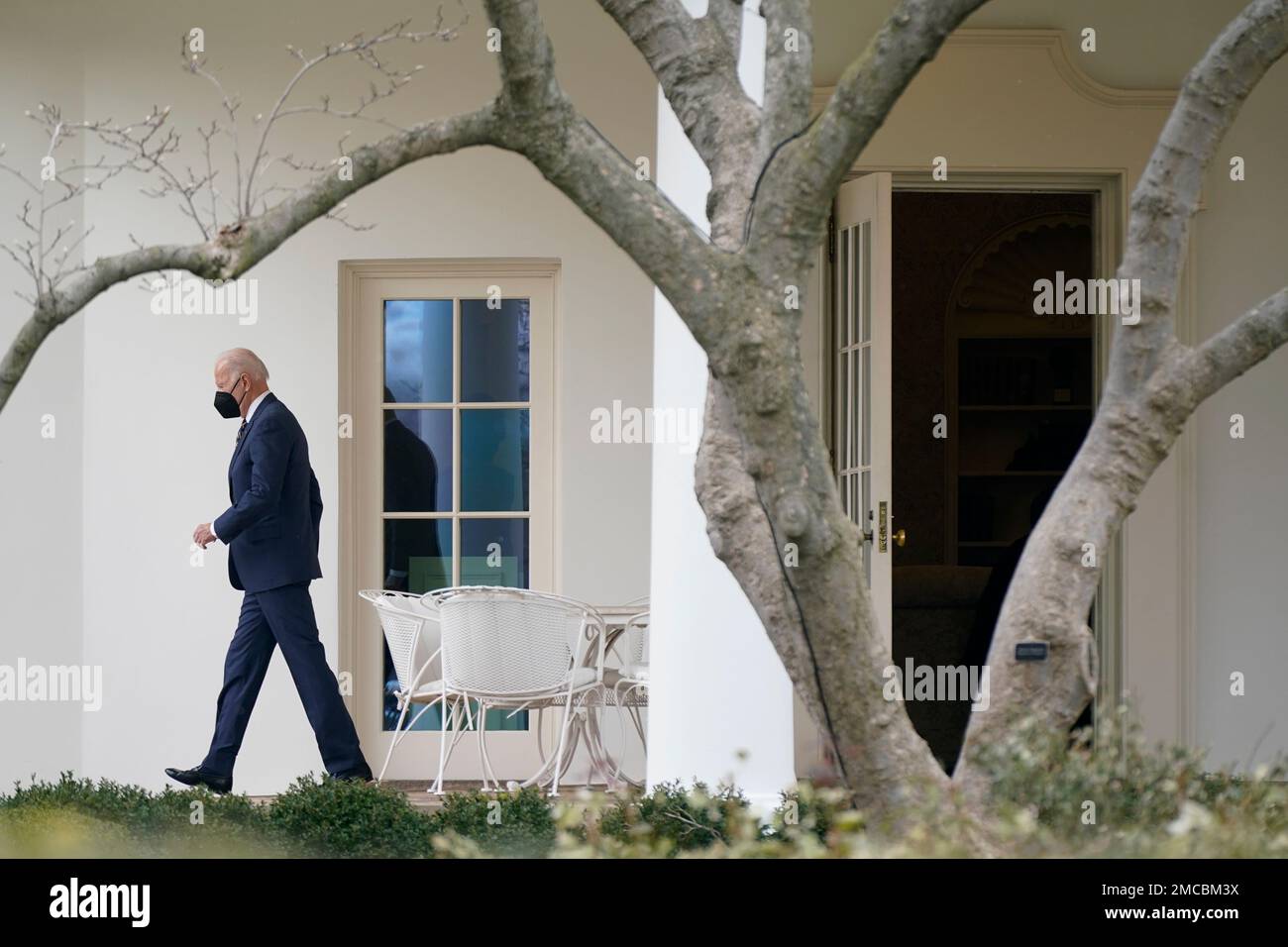 President Joe Biden walks out of the Oval Office of the White House ...