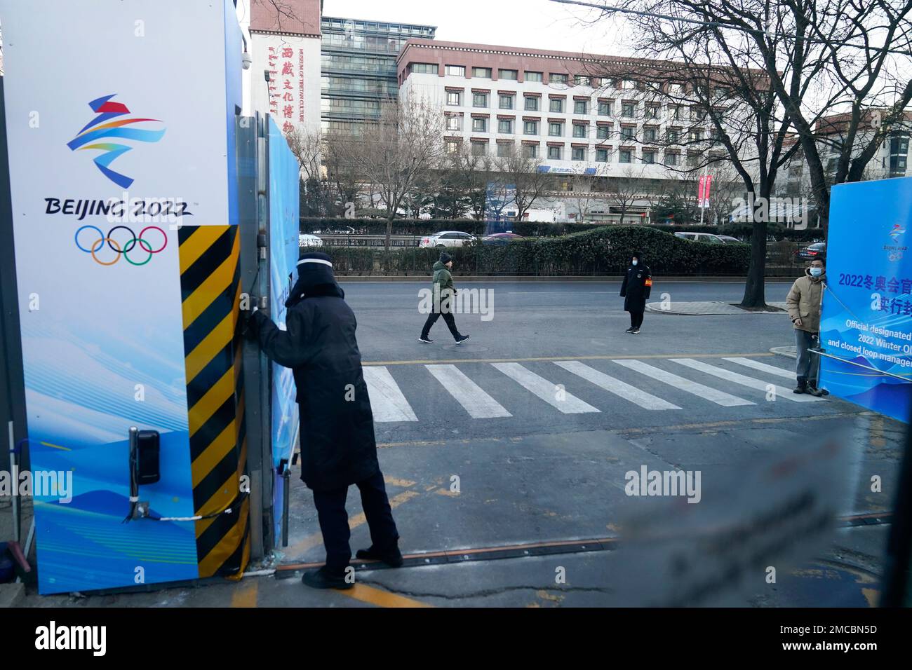 Guards open a gate as an Olympic shuttle bus leaves a hotel ahead of ...