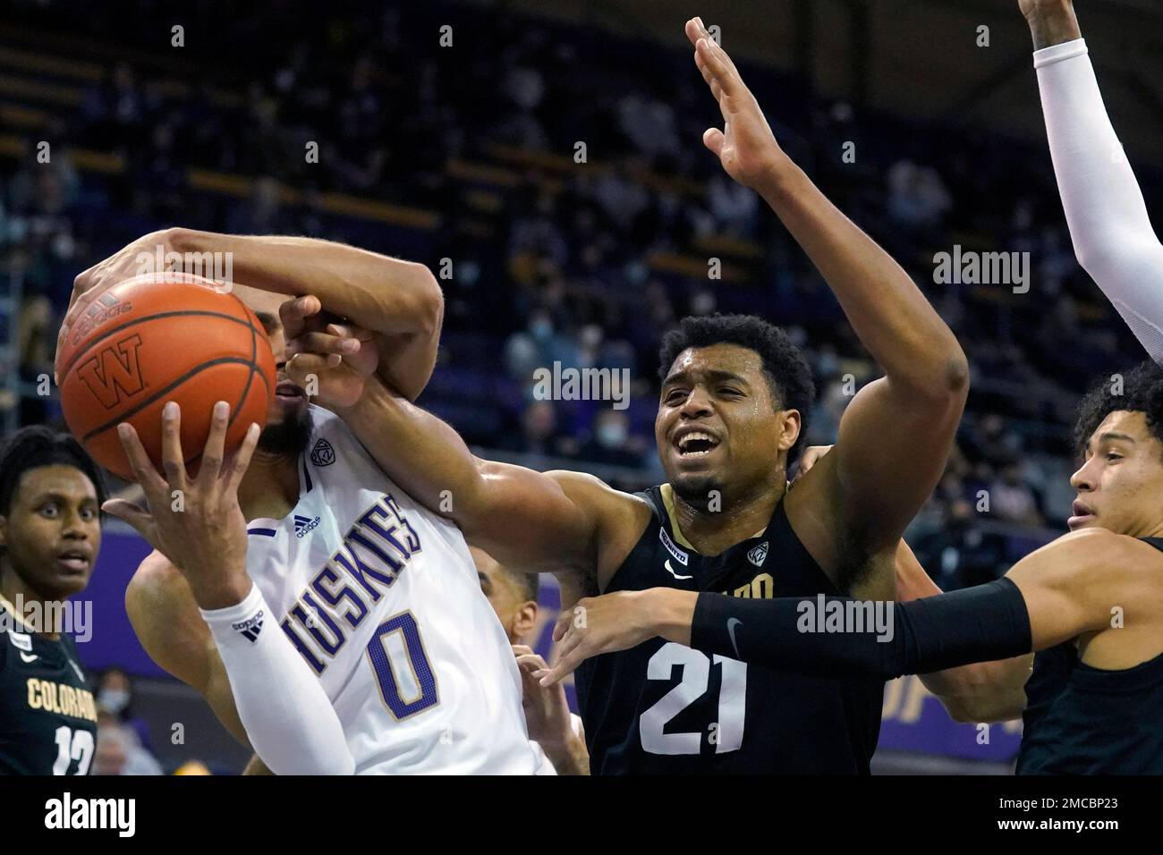 Washington forward Emmitt Matthews Jr. (0) and Colorado forward Evan ...