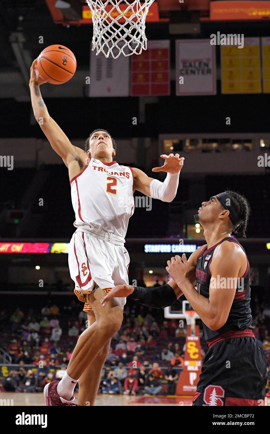 Southern California forward Kobe Johnson, left, shoots as Stanford ...