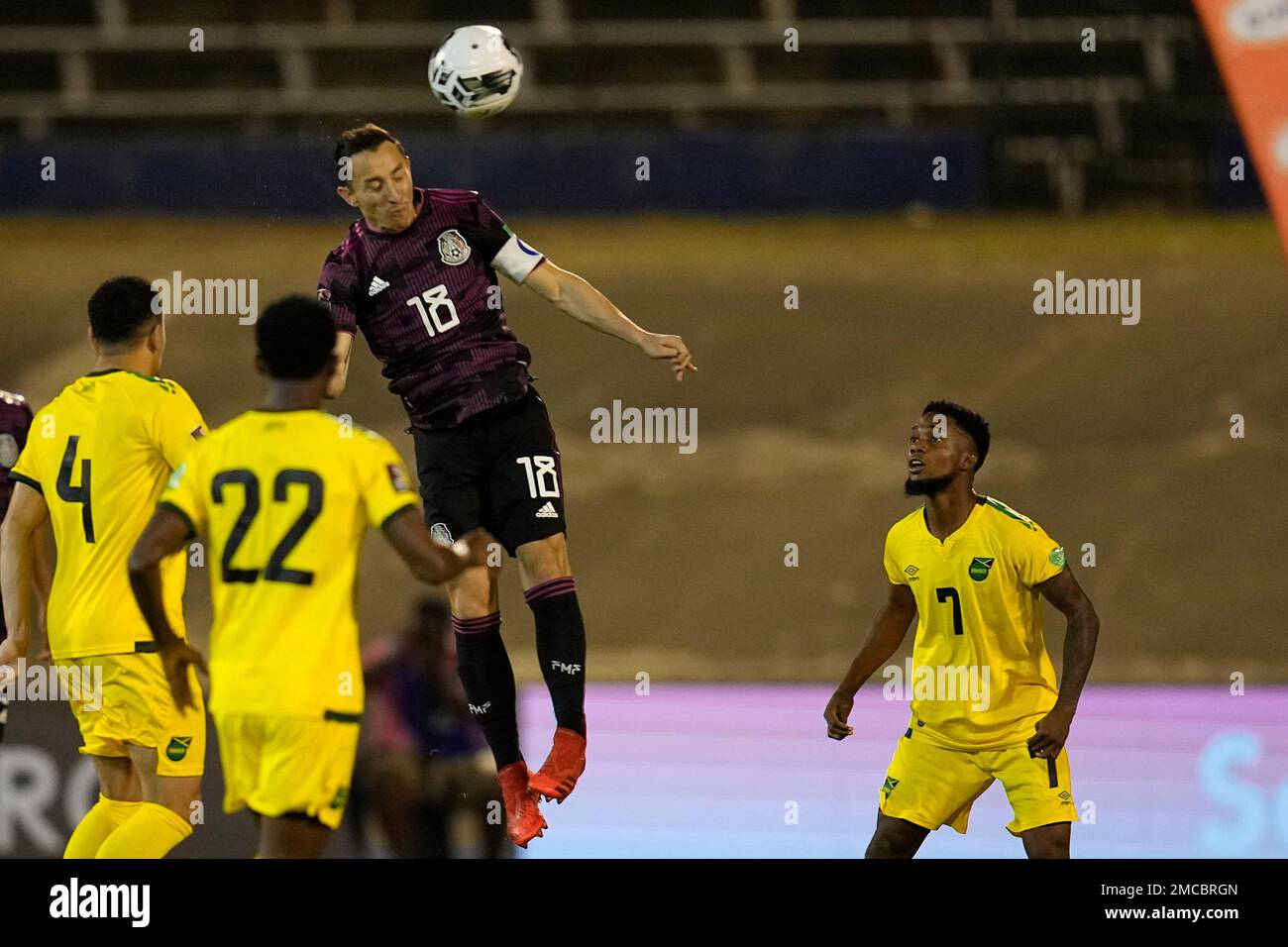 Mexico's Jose Andres Guardado heads the ball under the watch of Jamaica ...