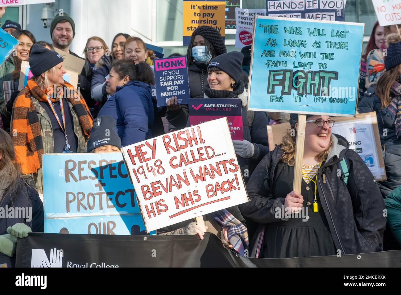Striking nurses with placards, demonstrating outside University College ...