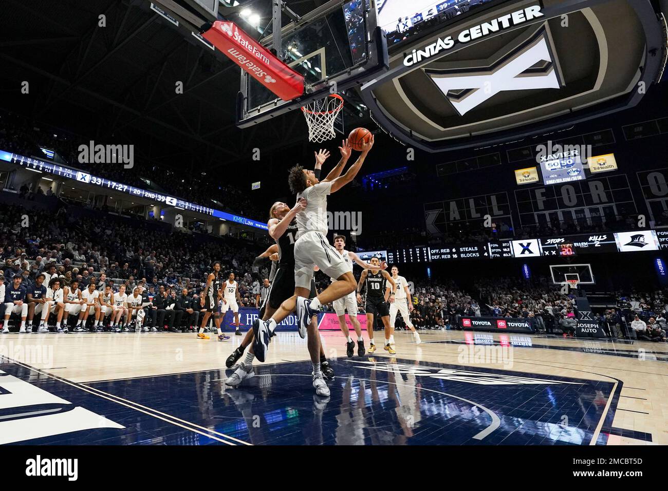 Xavier guard Colby Jones, center right, shoots during the second half ...