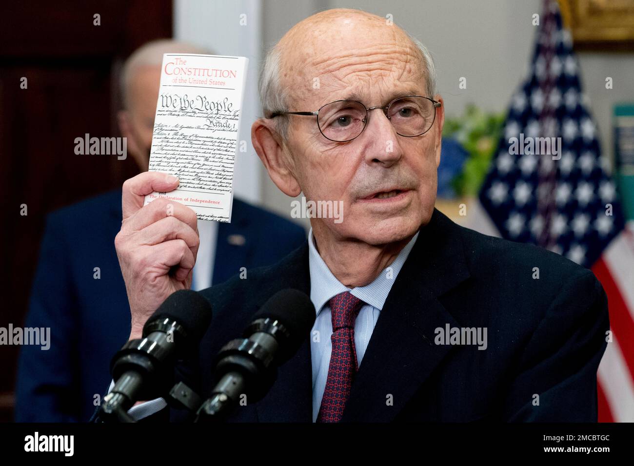 Supreme Court Associate Justice Stephen Breyer holds up a copy of the ...