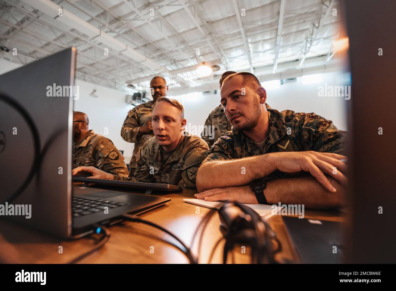 A member of the 169th Cyber Protection Team and members of the Armed ...
