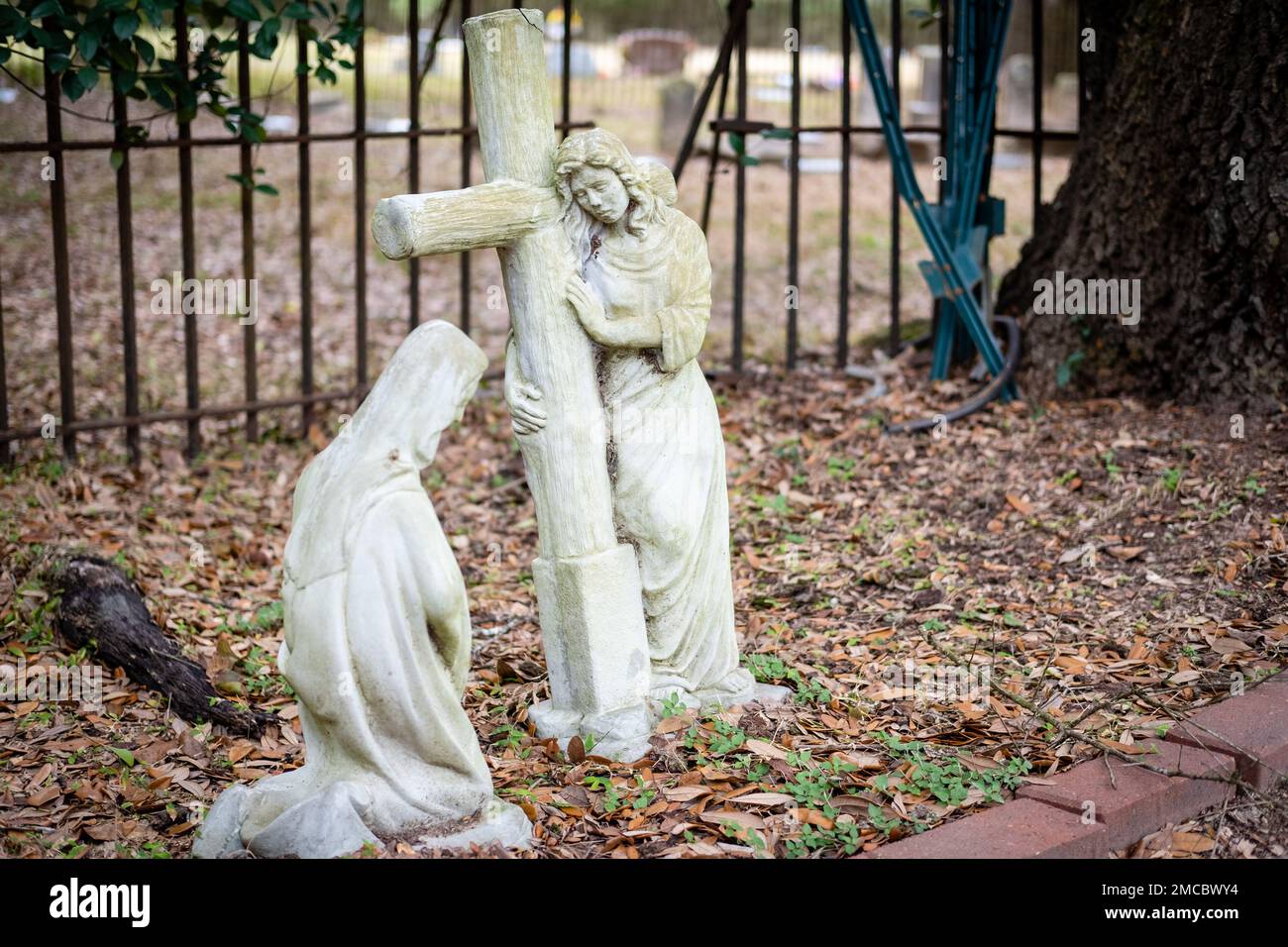 An old and historic small cemetery with headstones and rusted gates in ...