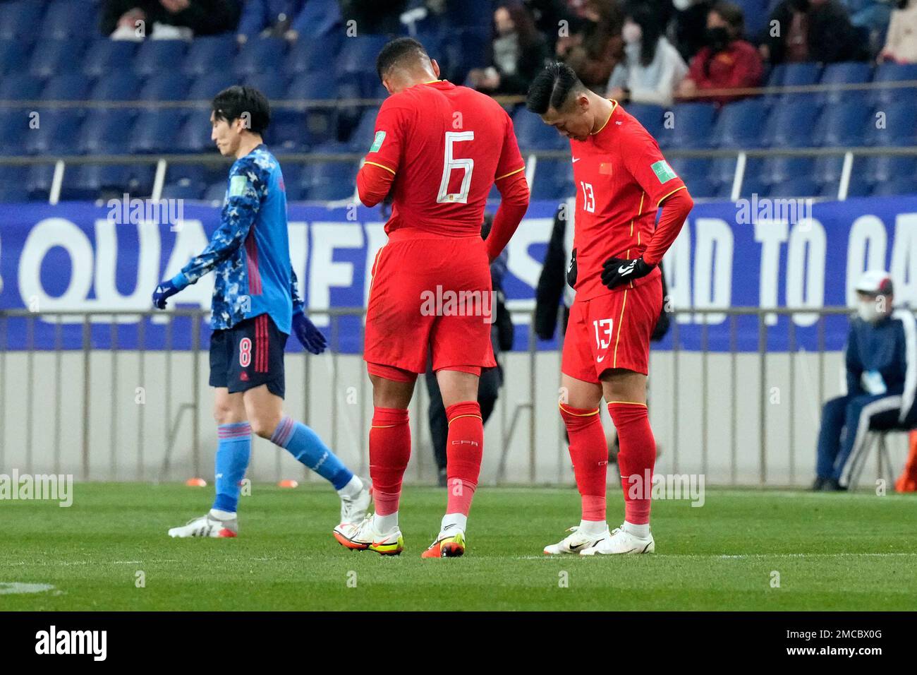 China's Jiang Guangtai and Xu Xin react after the World Cup 2022 group ...