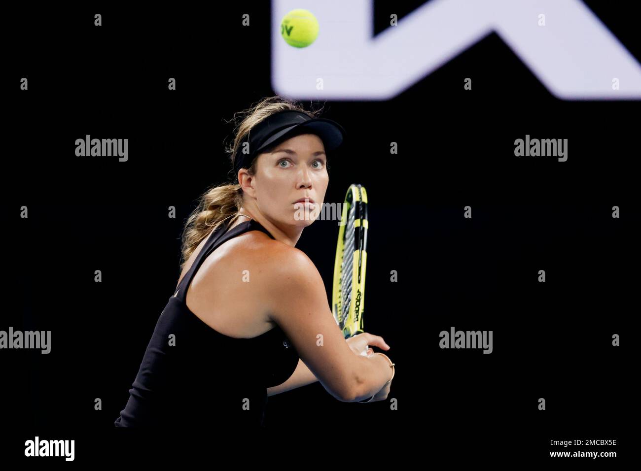 Danielle Collins of the U.S. plays a backhand return to Iga Swiatek of ...