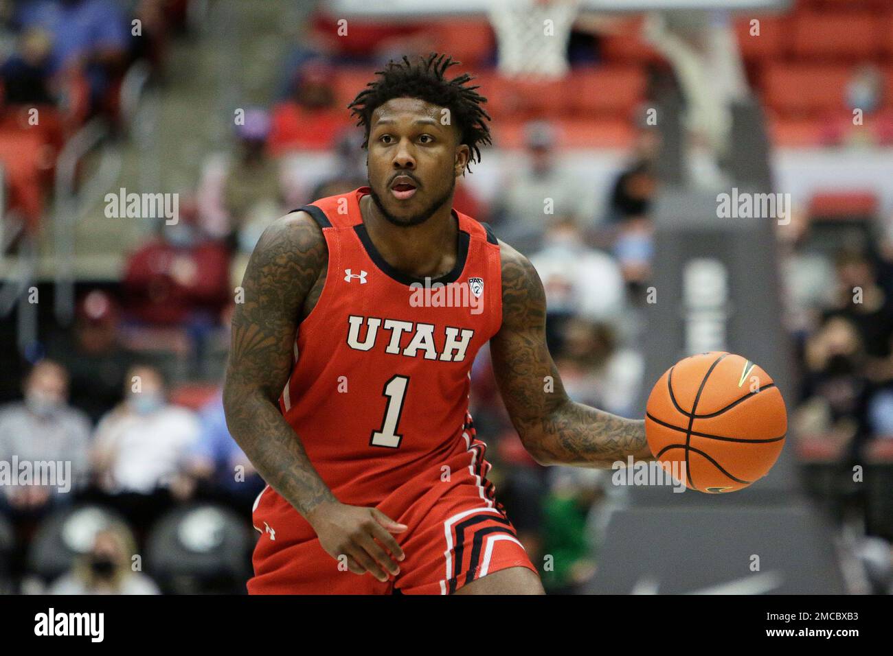 Utah guard David Jenkins Jr. controls the ball during the second half ...