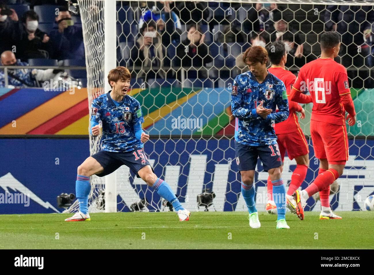 Japan's Yuya Osako, left, celebrates after scoring a goal during the ...
