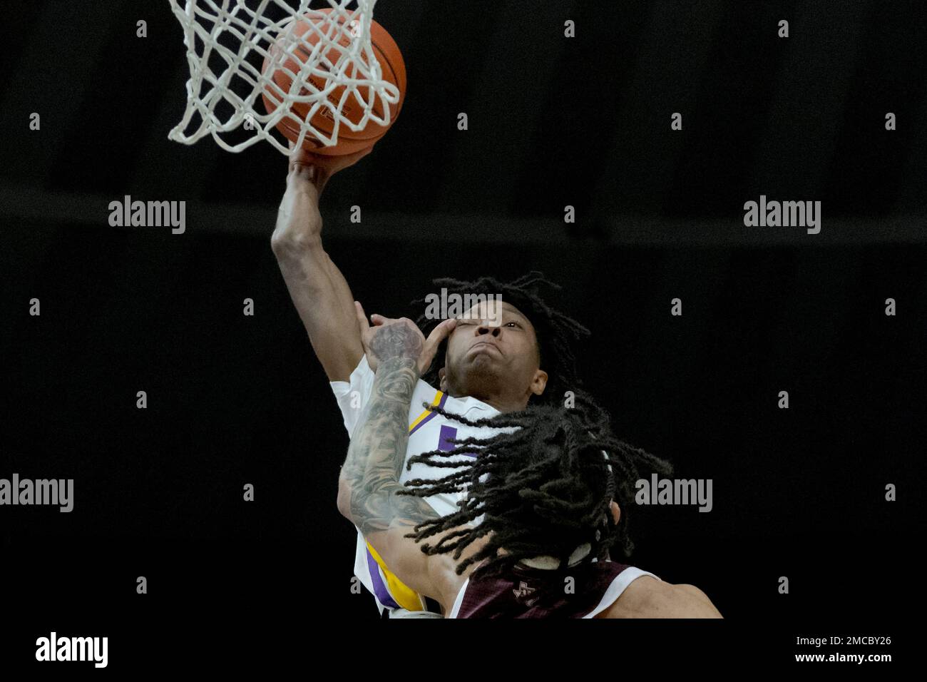 Texas A&M forward Ethan Henderson (10) touches the eye of LSU guard ...