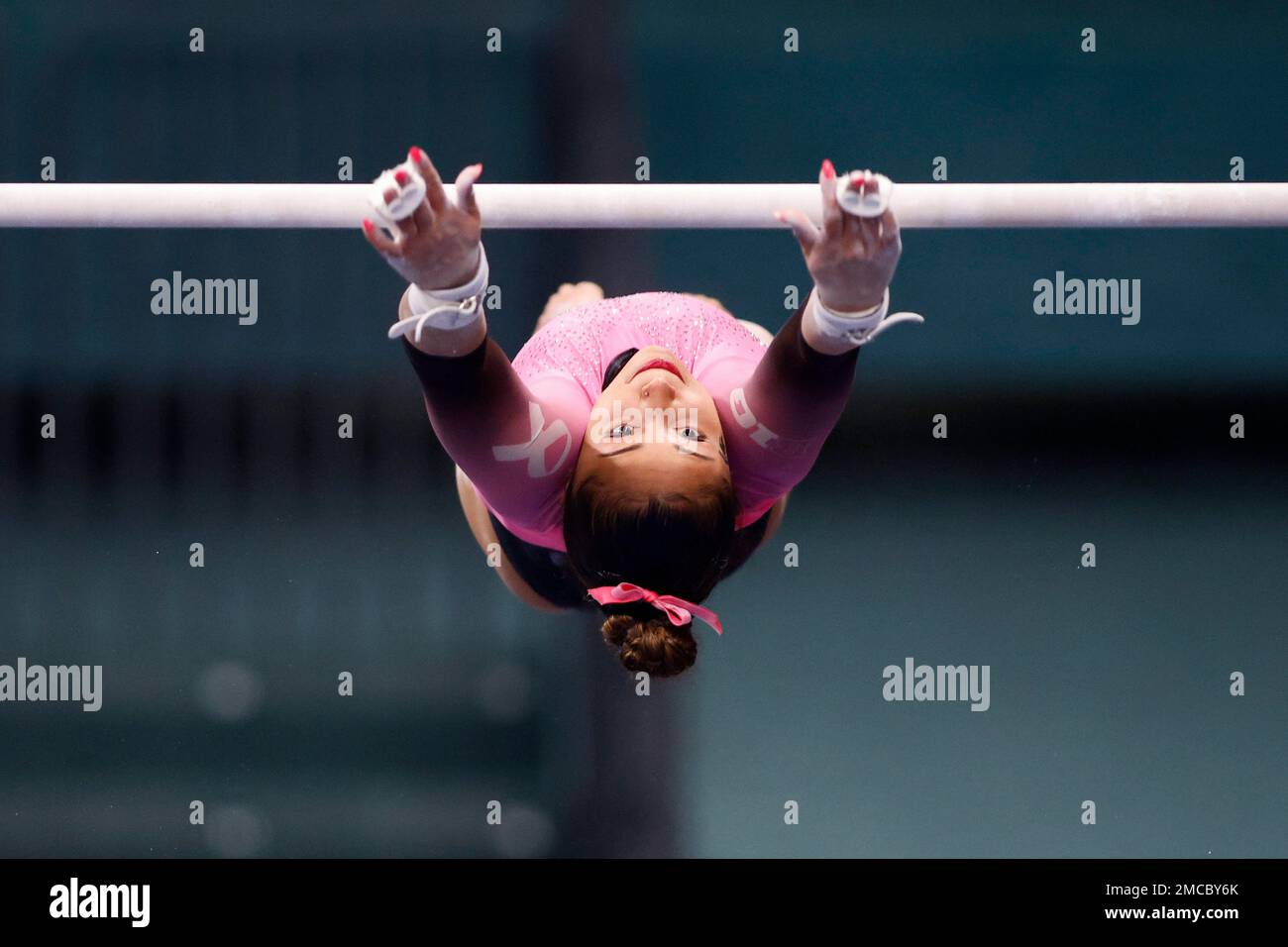 Michigan State's Lea Mitchell competes in the bars during an NCAA ...