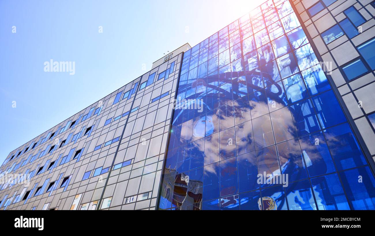 Architecture details. Modern glass building facade in sunny day ...
