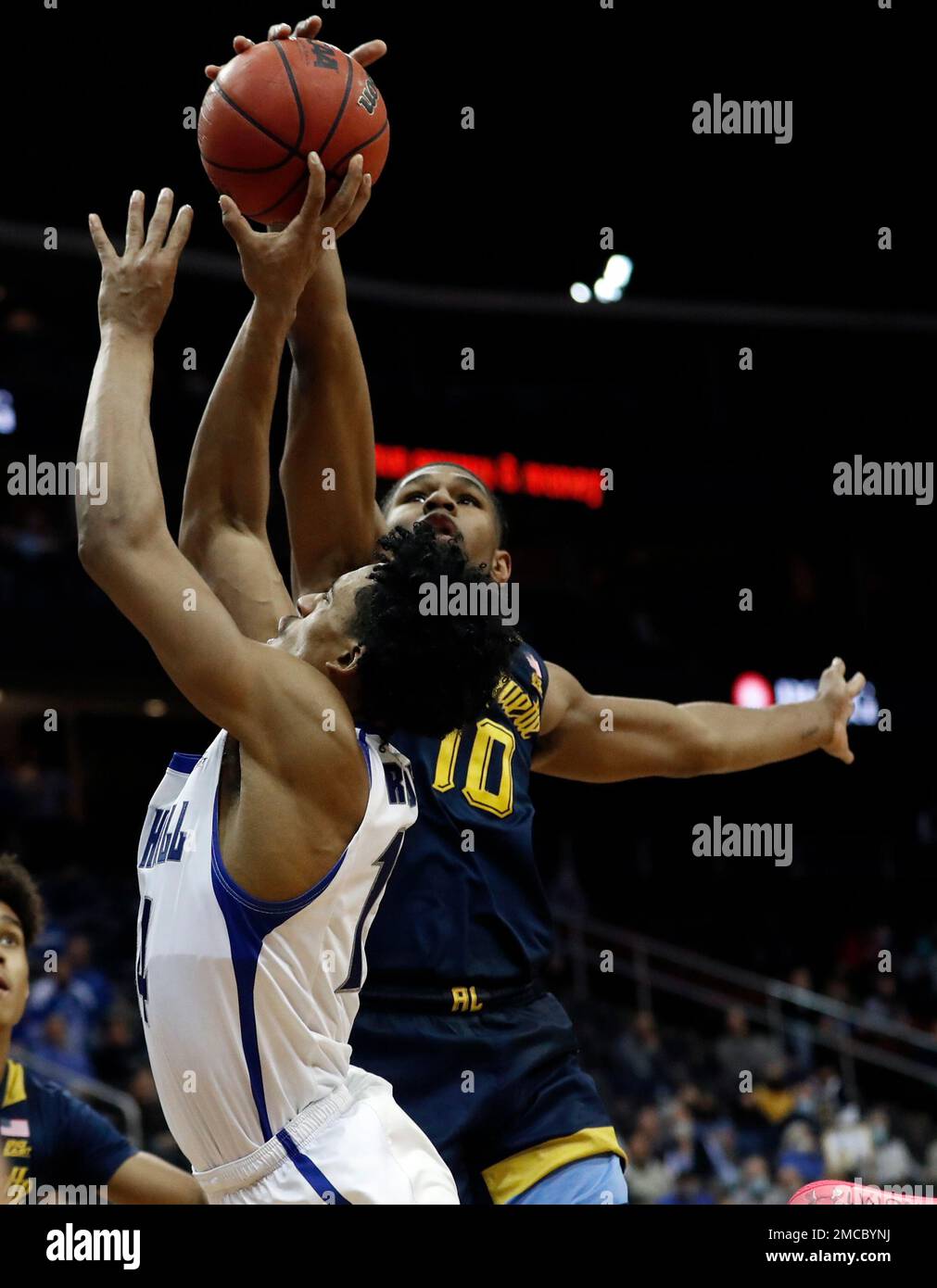 Marquette forward Justin Lewis (10) defends against Seton Hall guard ...