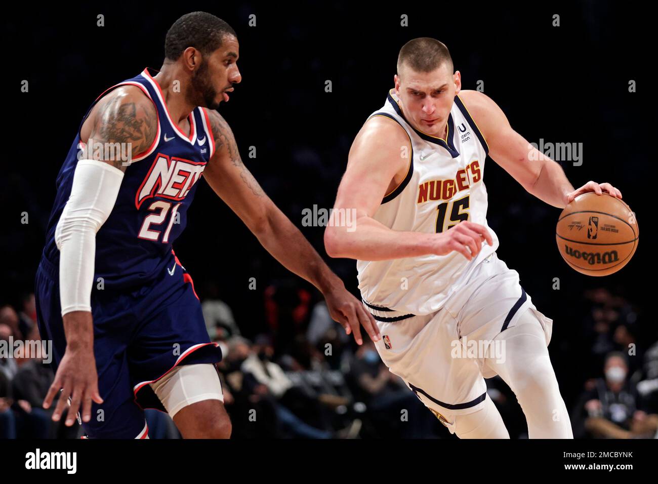 Denver Nuggets center Nikola Jokic (15) drives past Brooklyn Nets ...