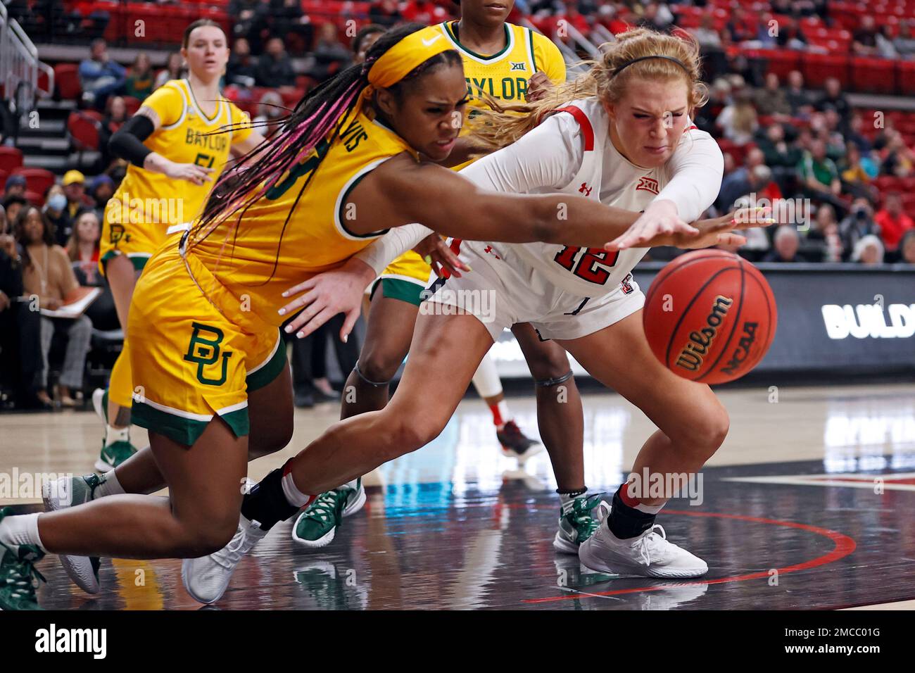 Baylor's Jordan Lewis (3) and Texas Tech's Vivian Gray (12) reach out ...