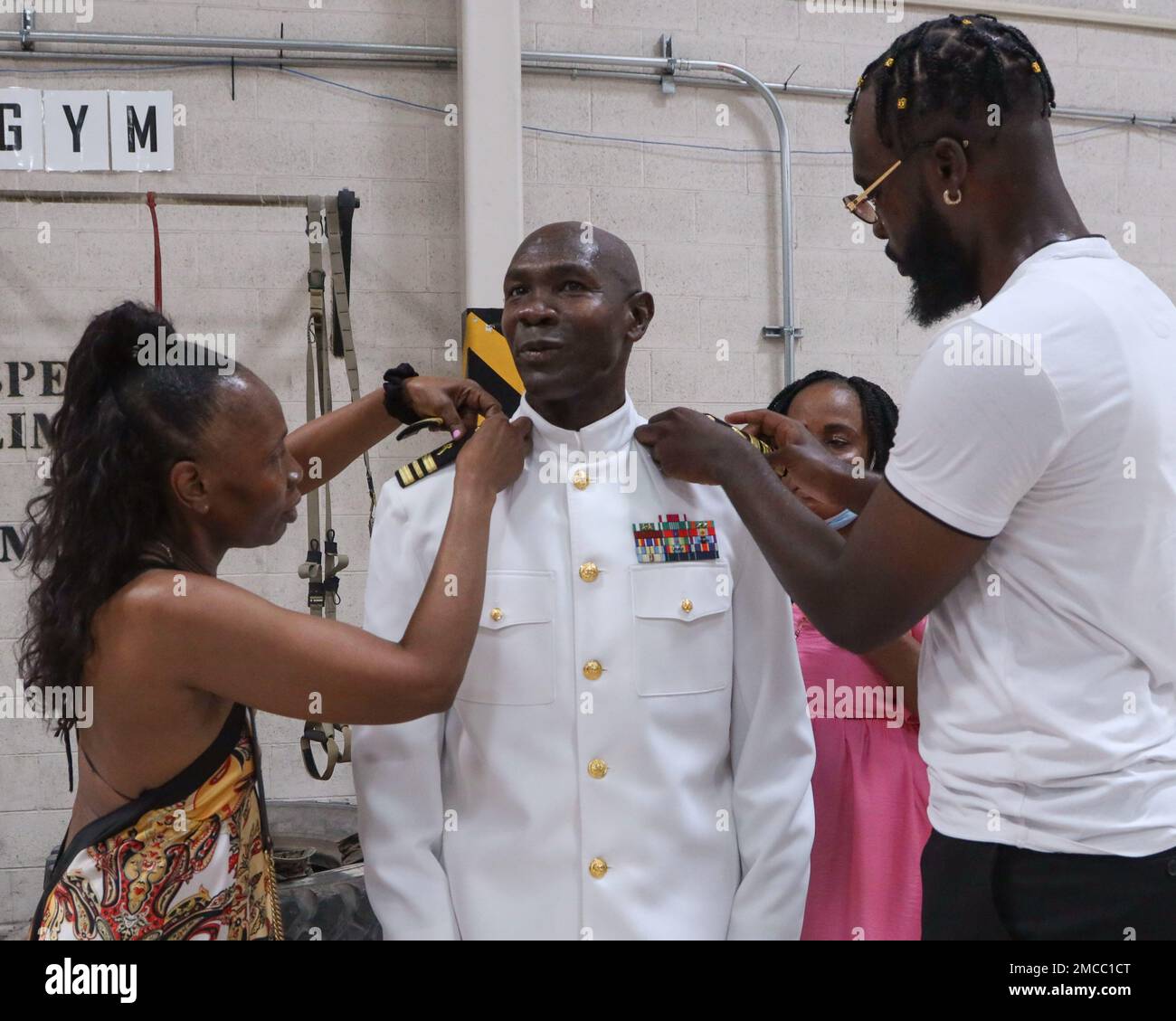 U.S. Navy Cmdr. Devon Foster, center, chaplain, Marine Aircraft Group ...