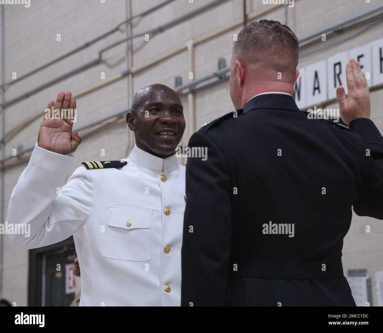U.S. Navy Cmdr. Devon Foster, left, chaplain, Marine Aircraft Group 13 ...