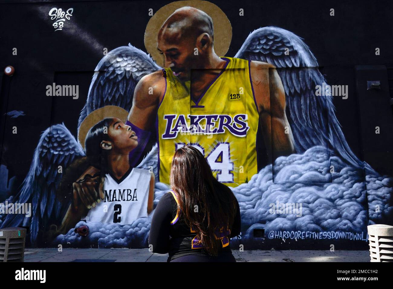 Dianna Rodriguez looks up at a mural of former Los Angeles Lakers NBA ...