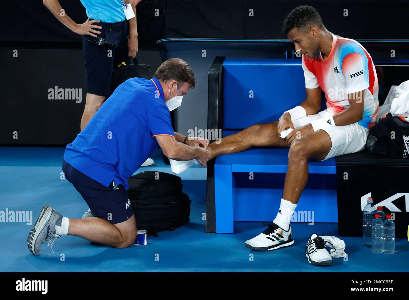 Felix Auger-Aliassime of Canada has his foot taped during his quarterfinal against Daniil ...