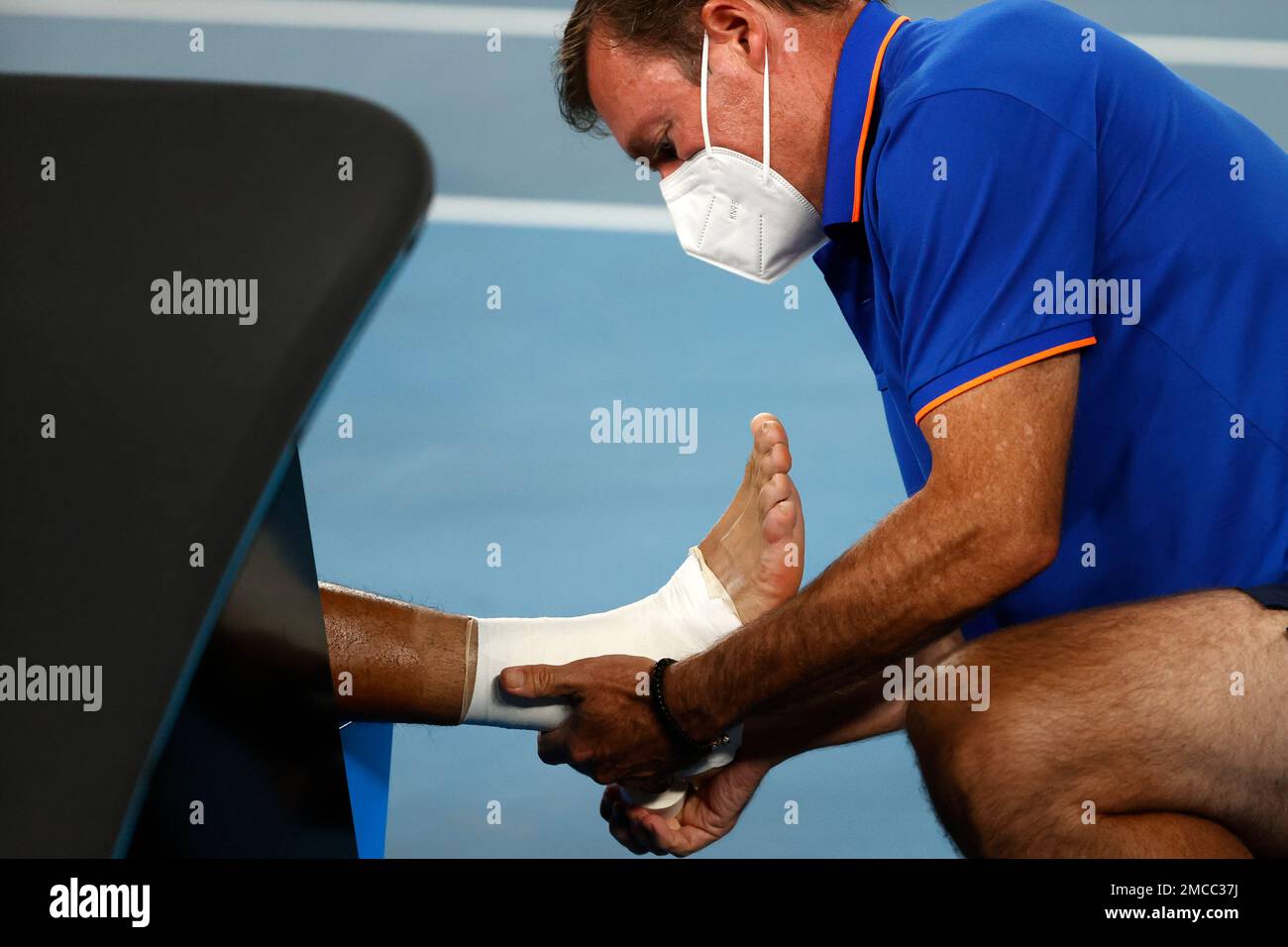 Felix Auger-Aliassime of Canada has his foot taped during his quarterfinal against Daniil ...