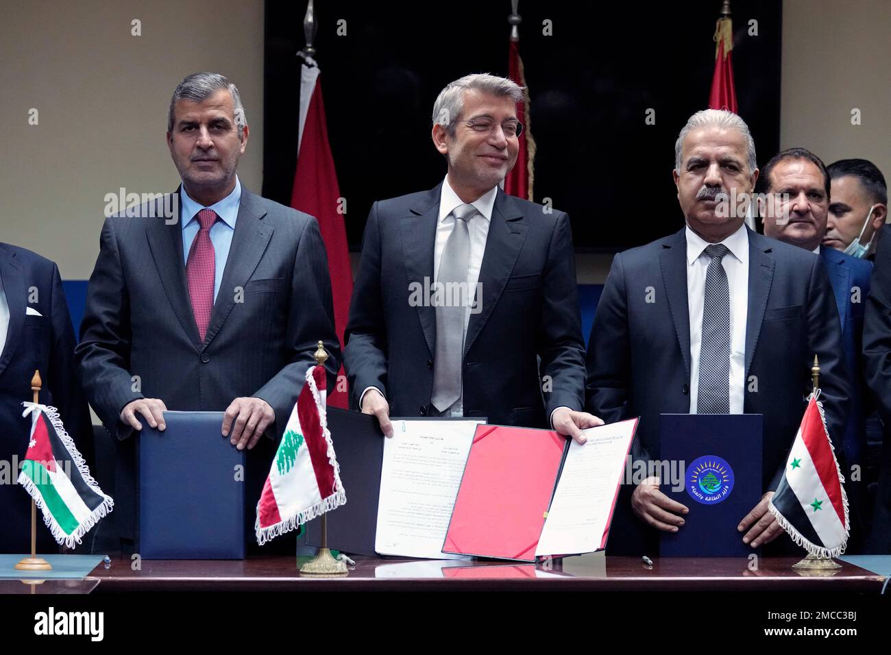 Lebanon's Energy Minister Walid Fayyad, center, Jordanian Energy ...