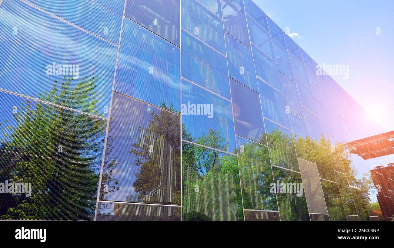Architecture details. Modern glass building facade in sunny day ...