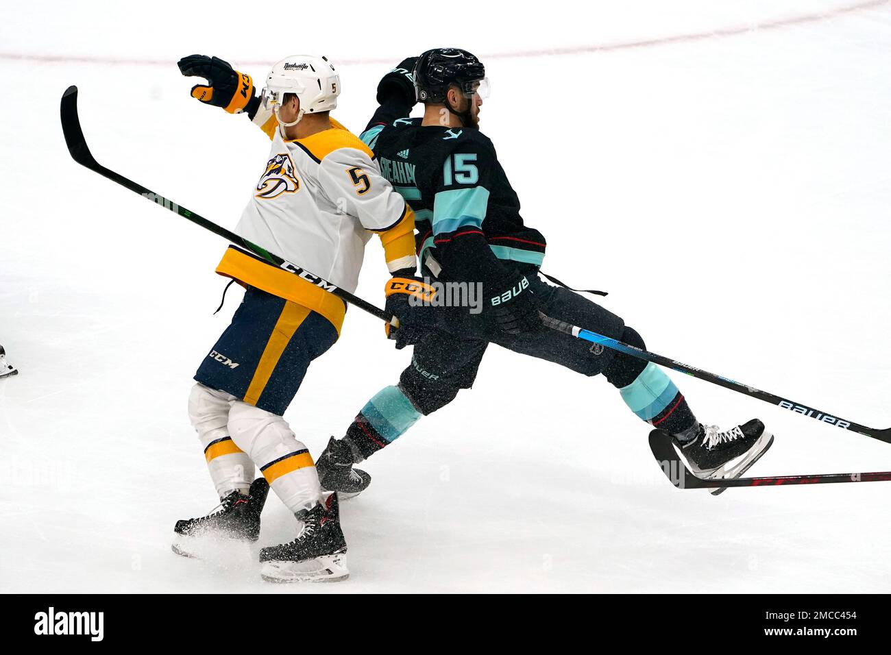 Nashville Predators' Matt Benning (5) tumbles back-to-back with Seattle ...