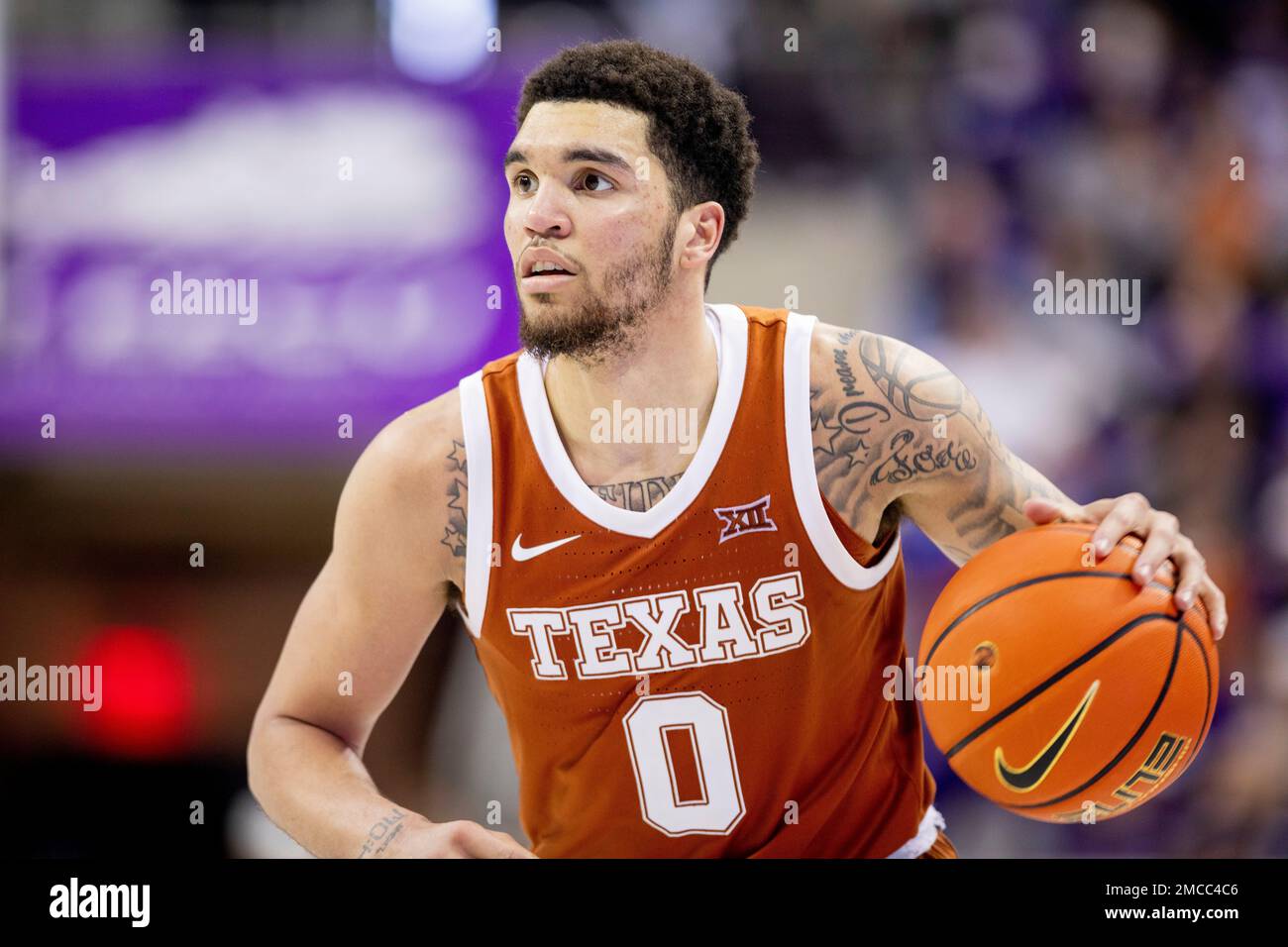 Texas forward Timmy Allen (0) looks down court in the second half of an ...