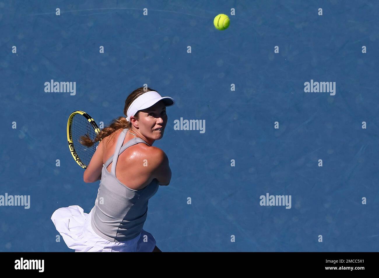 Danielle Collins of the U.S. plays a backhand return to Alize Cornet of ...