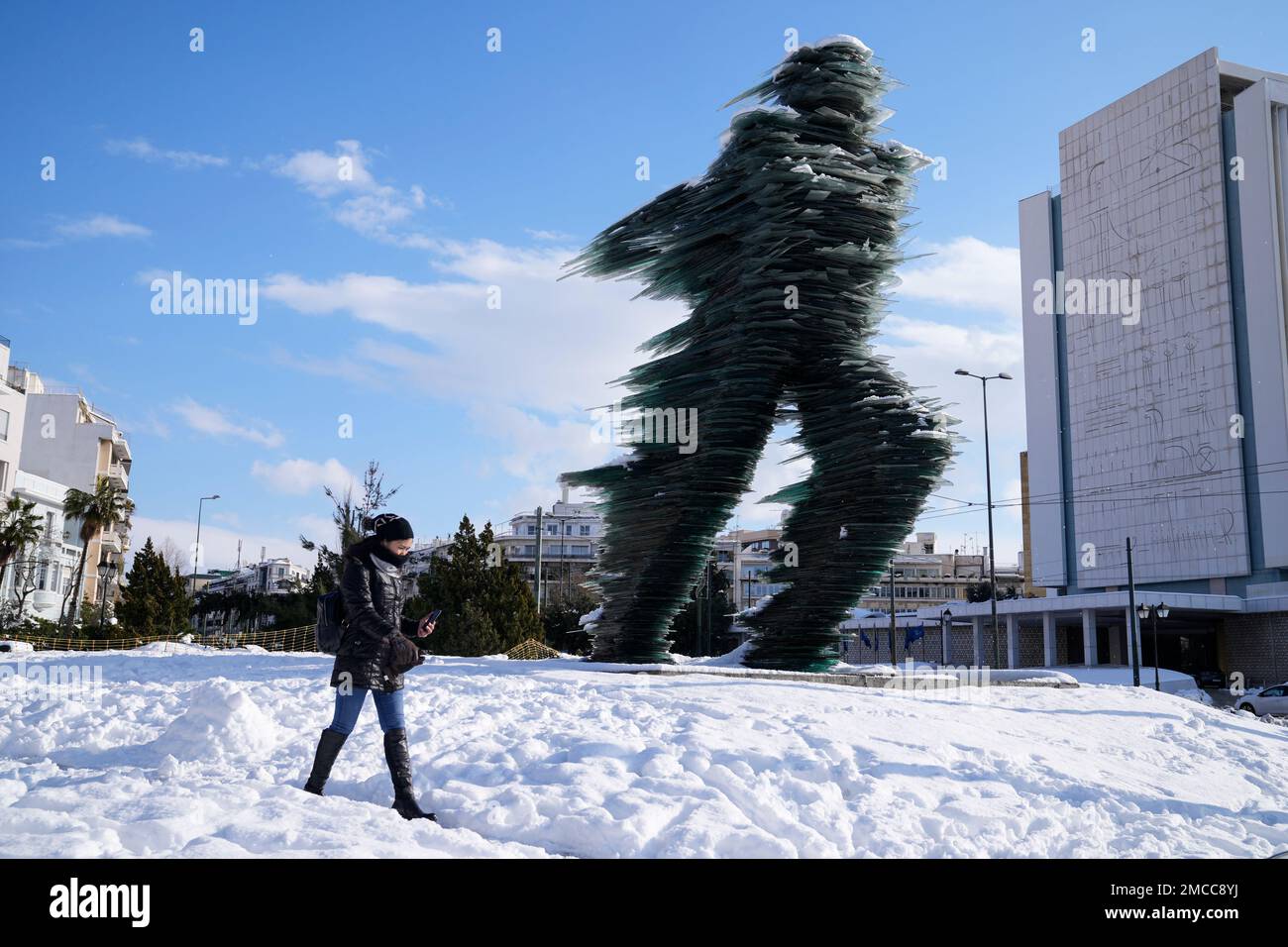 A woman walks past a the Runner, sculptured by Kostas Varotsos, after a ...